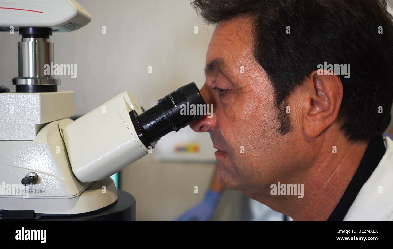 Biologist using microscope in lab Stock Video Footage - Alamy