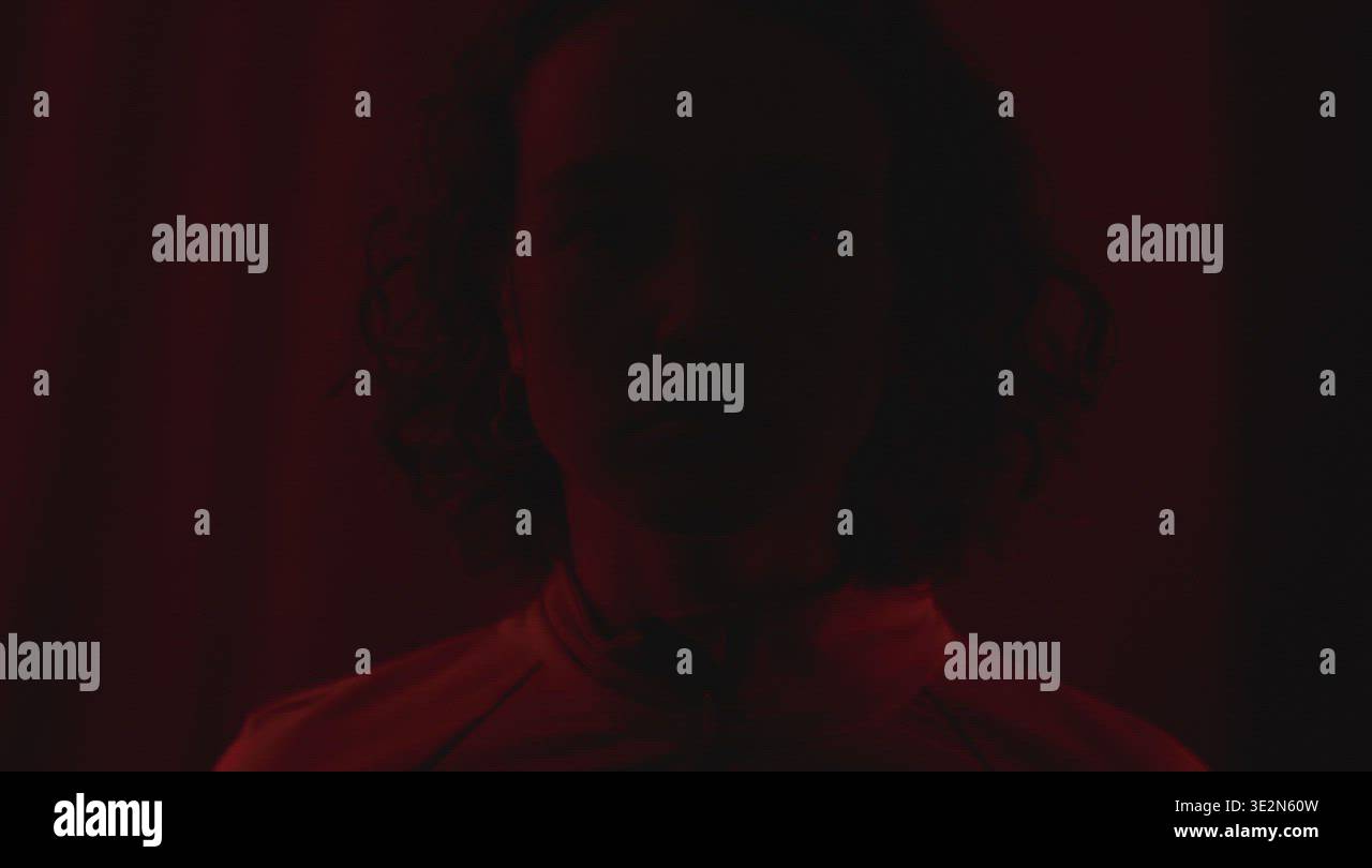 Young Woman In Red Neon Lighting Stock Video Footage - Alamy