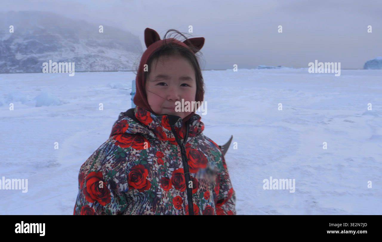 First Nations Inuit child in onesie costume smiling looking camera MCU ...