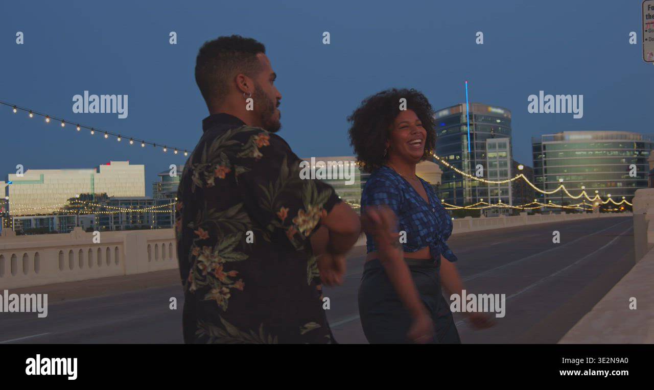 Young Black couple Nightlife dance on Bridge together on Bridge Stock ...