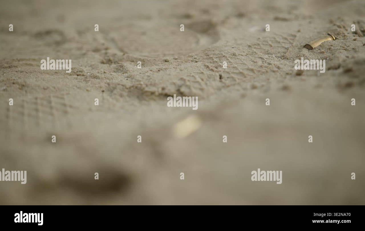 Bullets on sand. bullet casings/ sleeves Stock Video Footage - Alamy