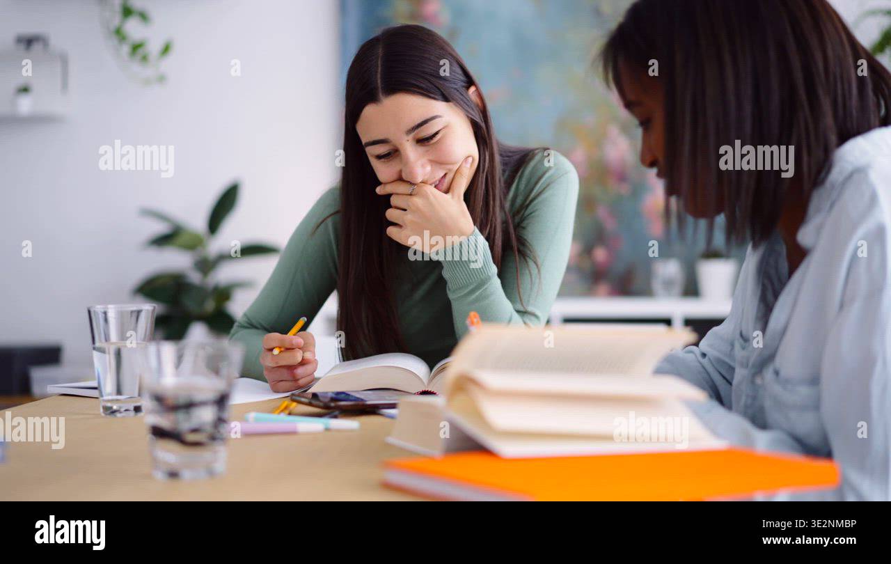 Female students using smartphone while doing homework Stock Video ...