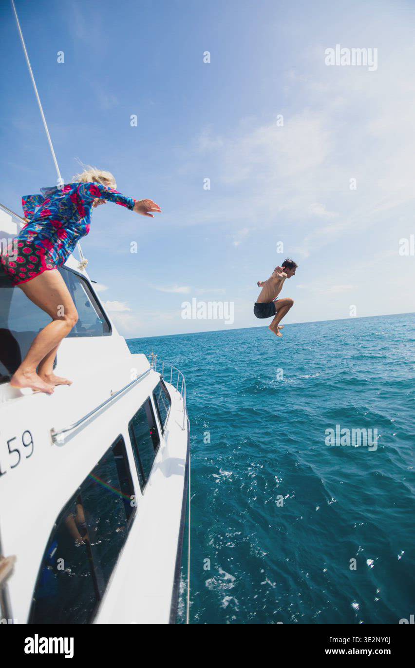Happy people jumping off the boat into the ocean Stock Video Footage ...