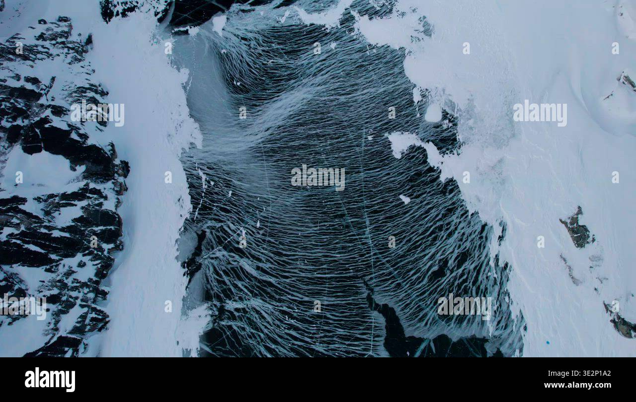 Winter sea ice forms in Arctic, wind patterns on frozen snowdrifts ...