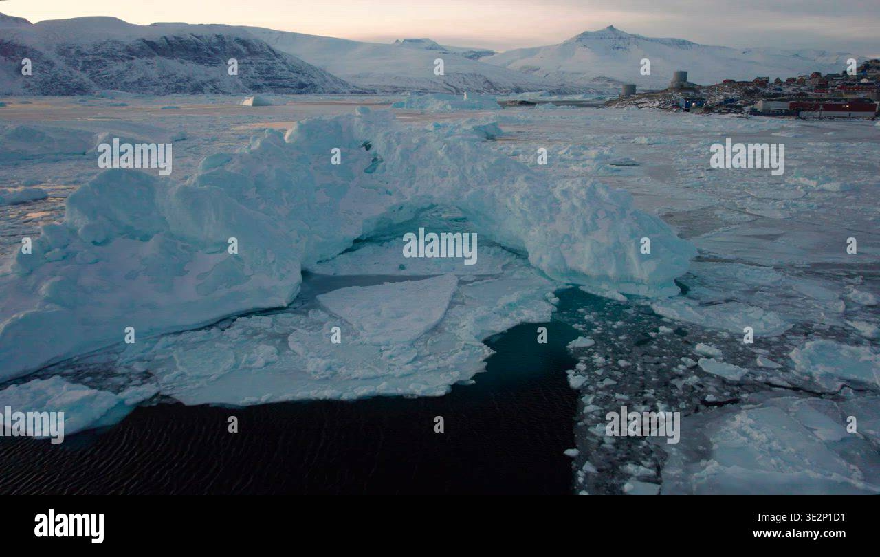 Drone aerial shot of arch iceberg in Greenland Arctic, polar winter ...