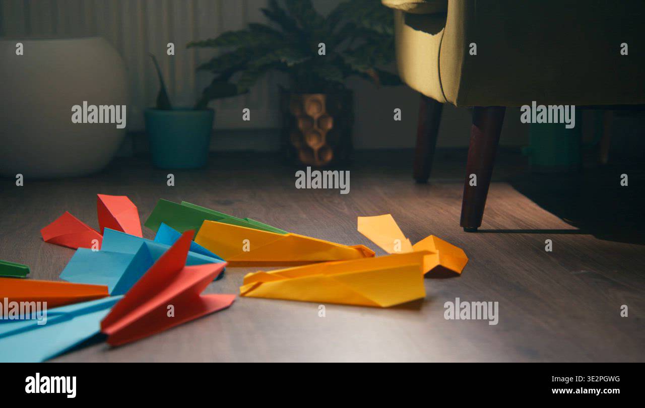 A paper airplane landing in a pile of multi coloured paper planes Stock ...