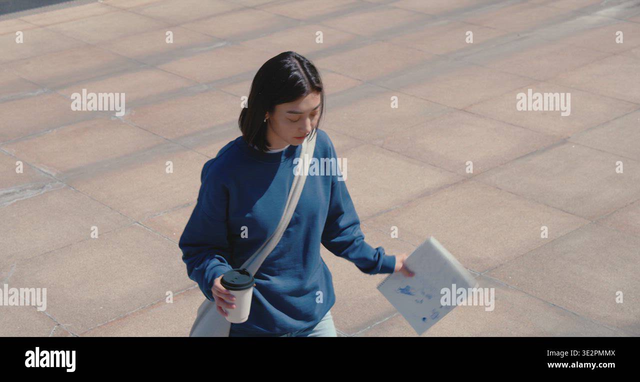 Asian student ascending university steps in morning Stock Video Footage ...
