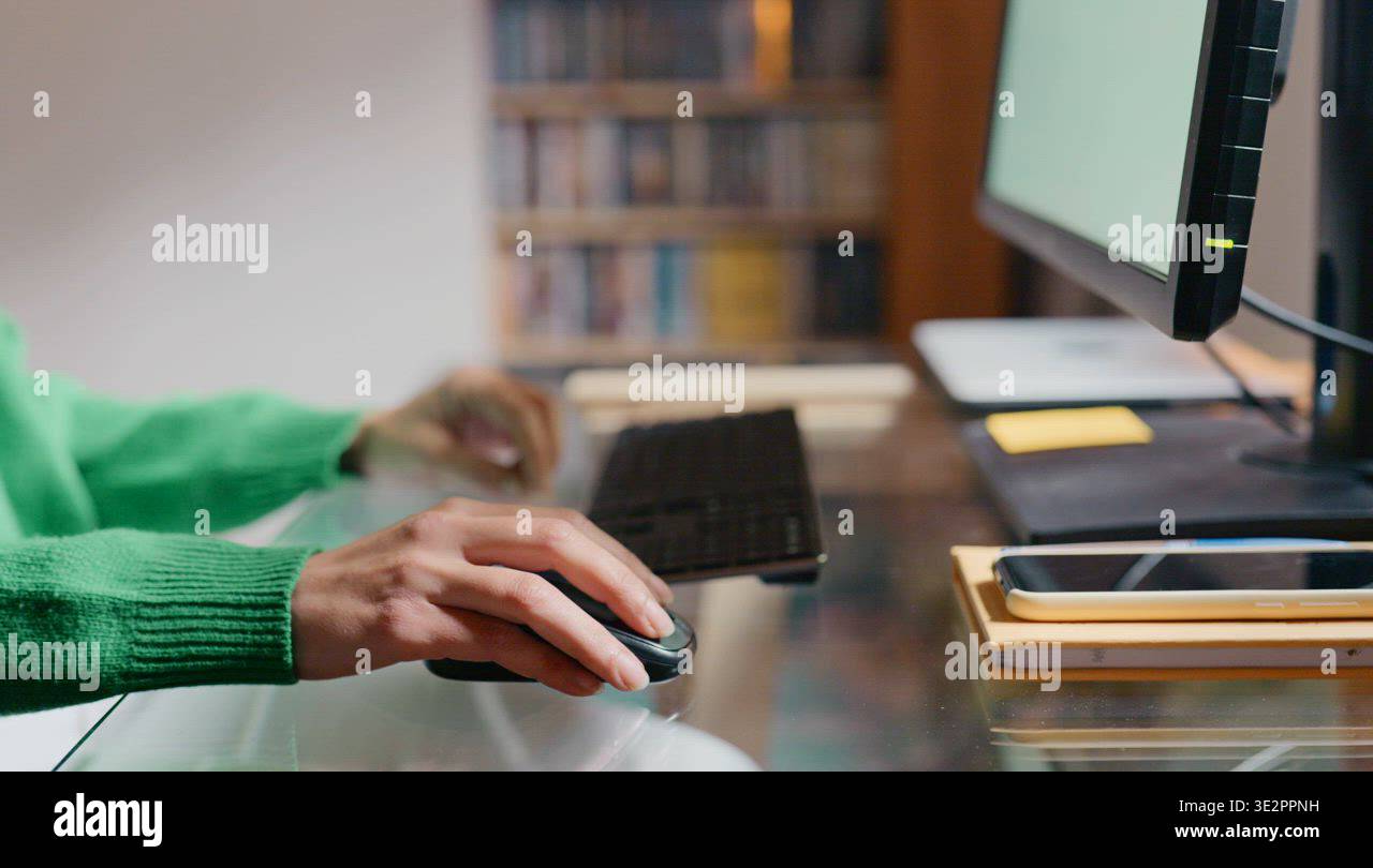 Anonymous woman turning off computer monitor Stock Video Footage - Alamy