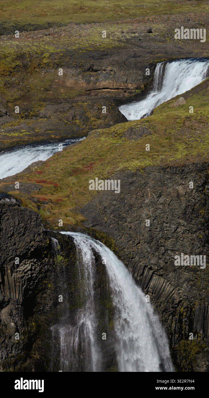 waterfall on cliff of basaltic strata with red clay between Stock Video ...