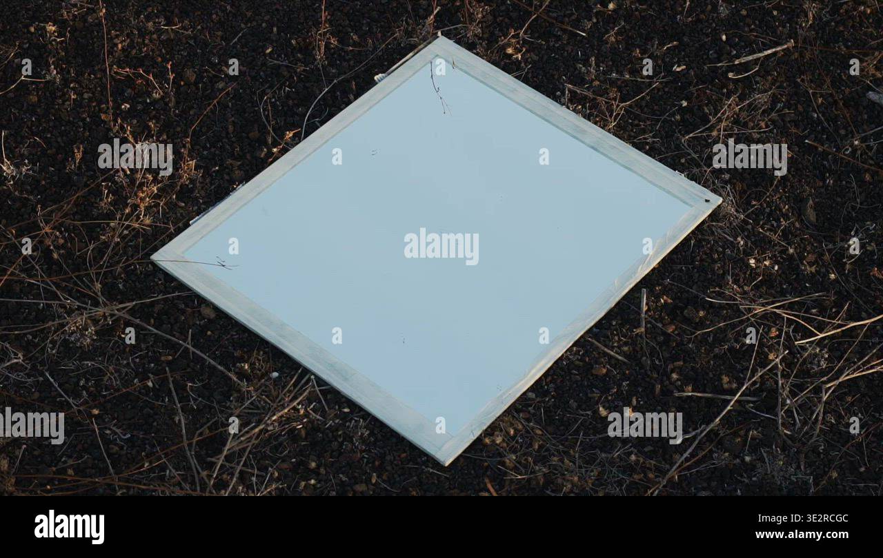 Slow-motion footage of a rock falling and shattering a mirror Stock ...