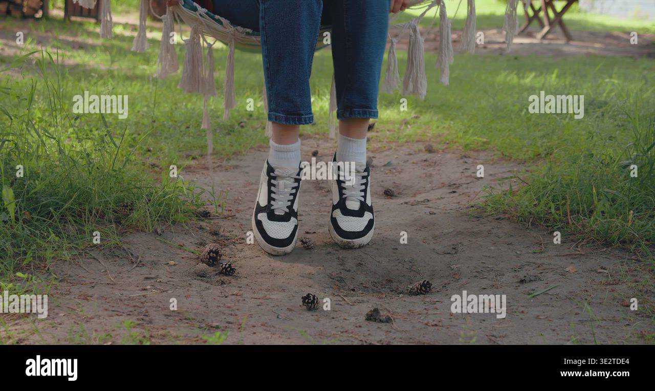 Close-Up of Woman's Feet in Sneakers on Hammock in Altai, Siberia Stock ...