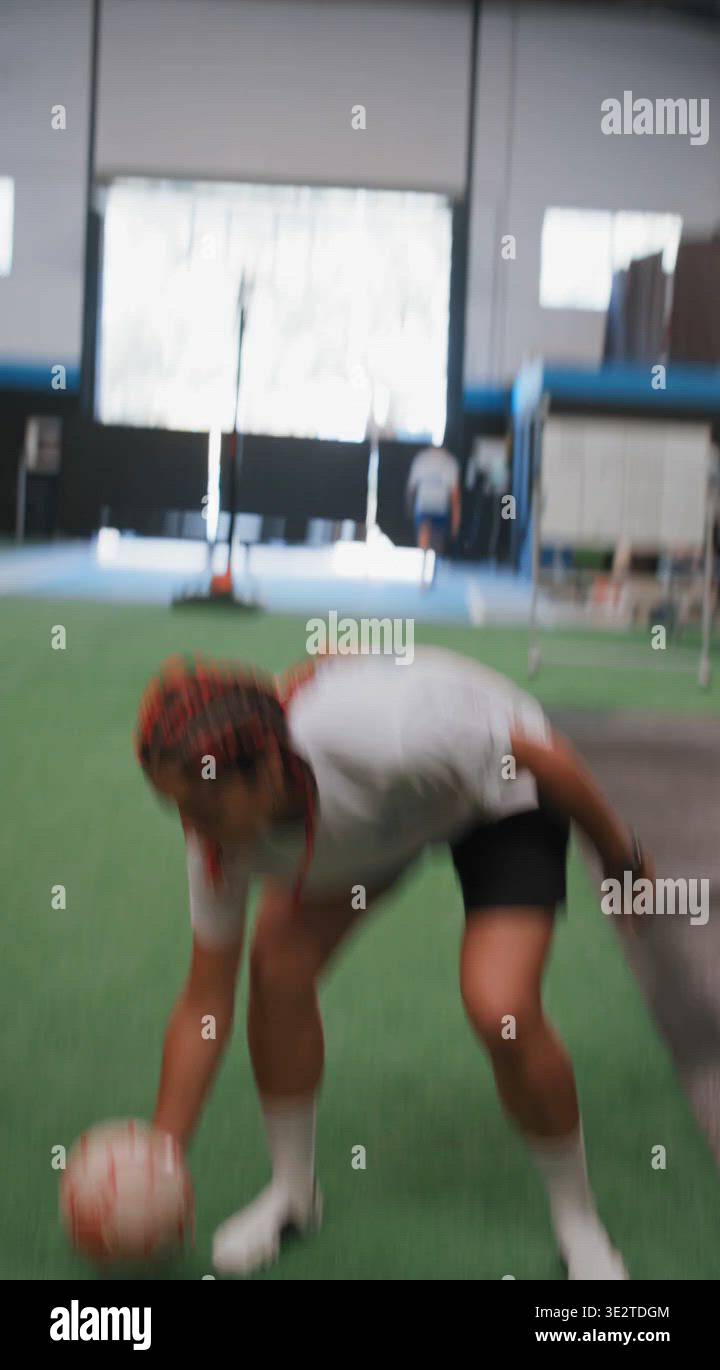 Female athlete doing keep-ups with ball Stock Video Footage - Alamy