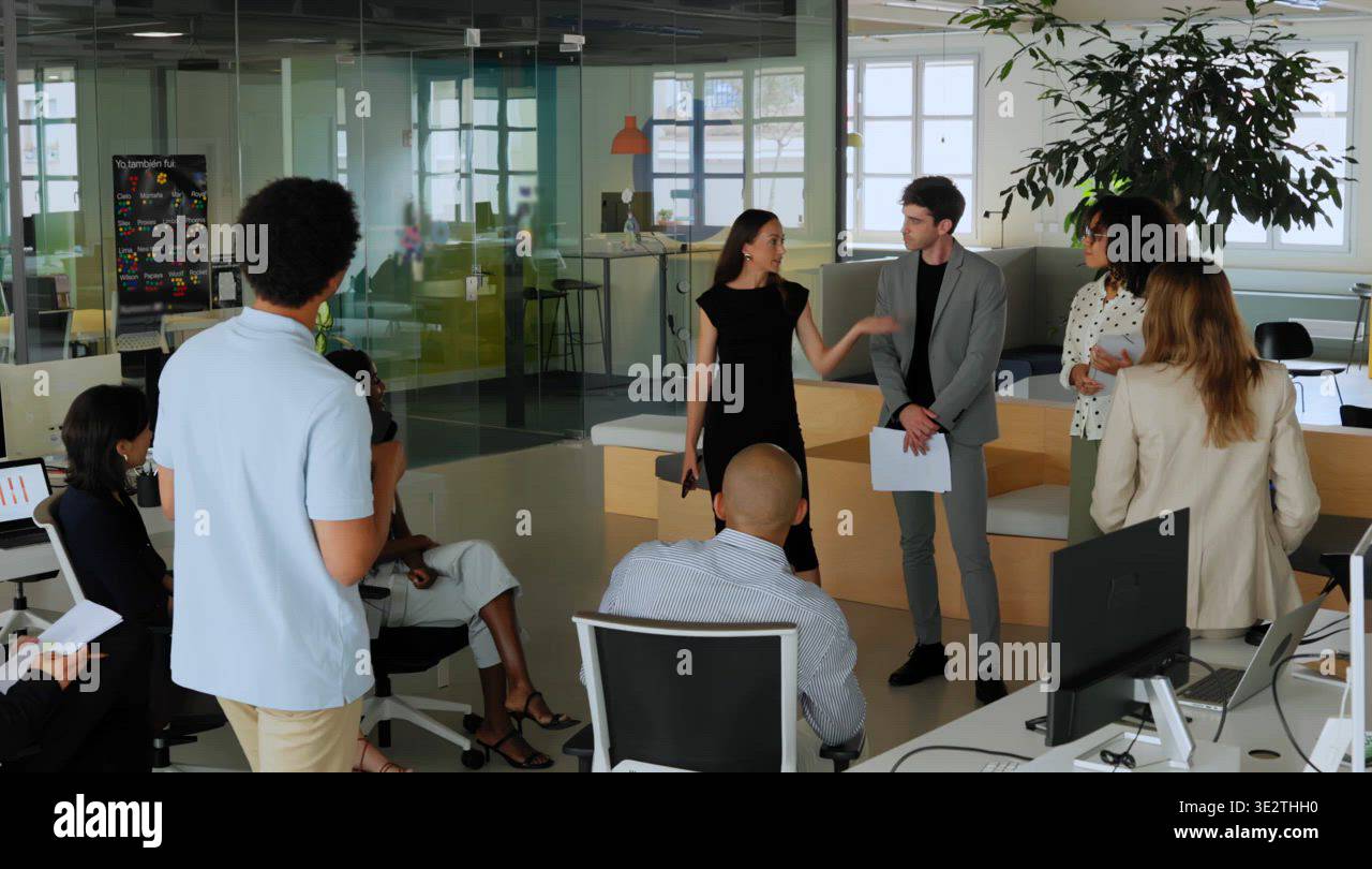 Team of professionals listening to diverse managers during meeting ...