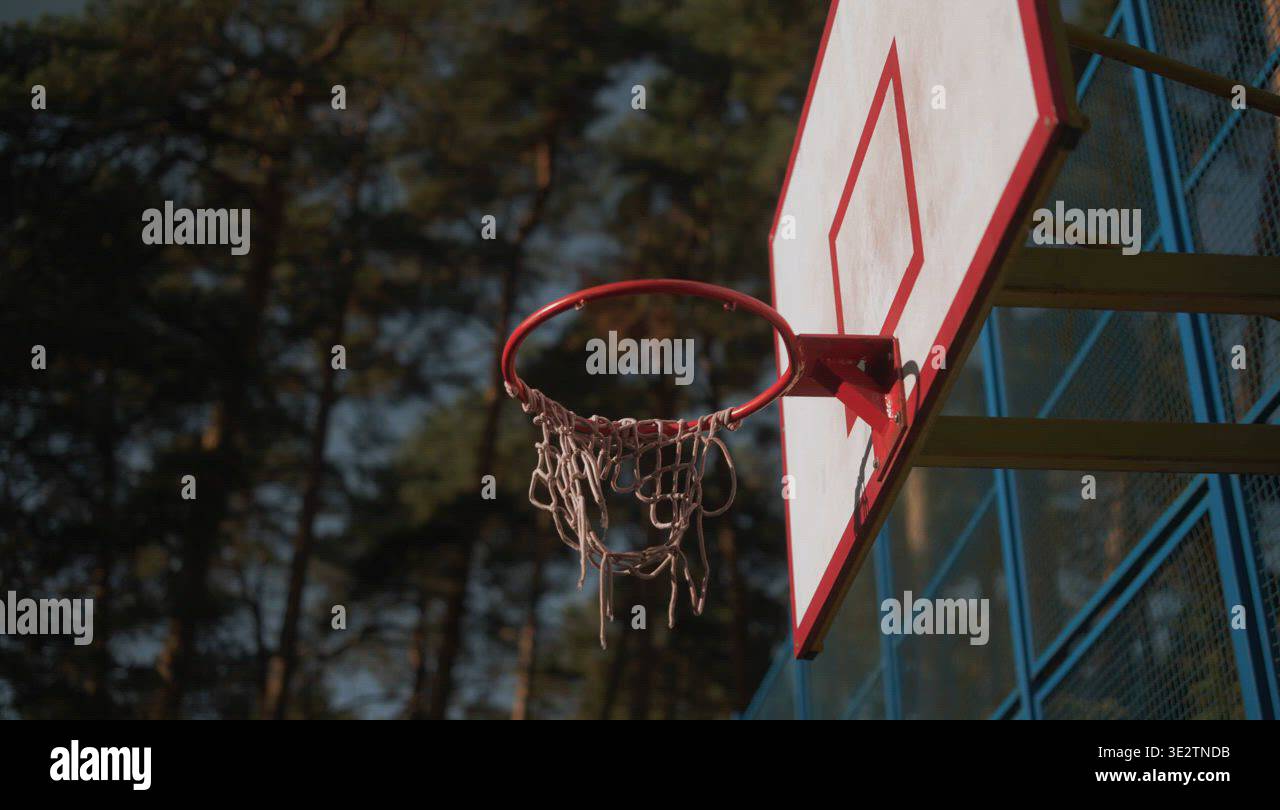 Ball hitting backboard and going through basketball hoop Stock Video ...