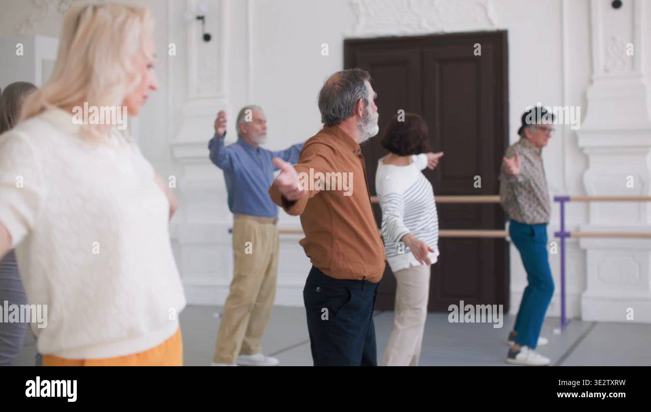 Old people learning to dance at group class in dance school Stock Video ...