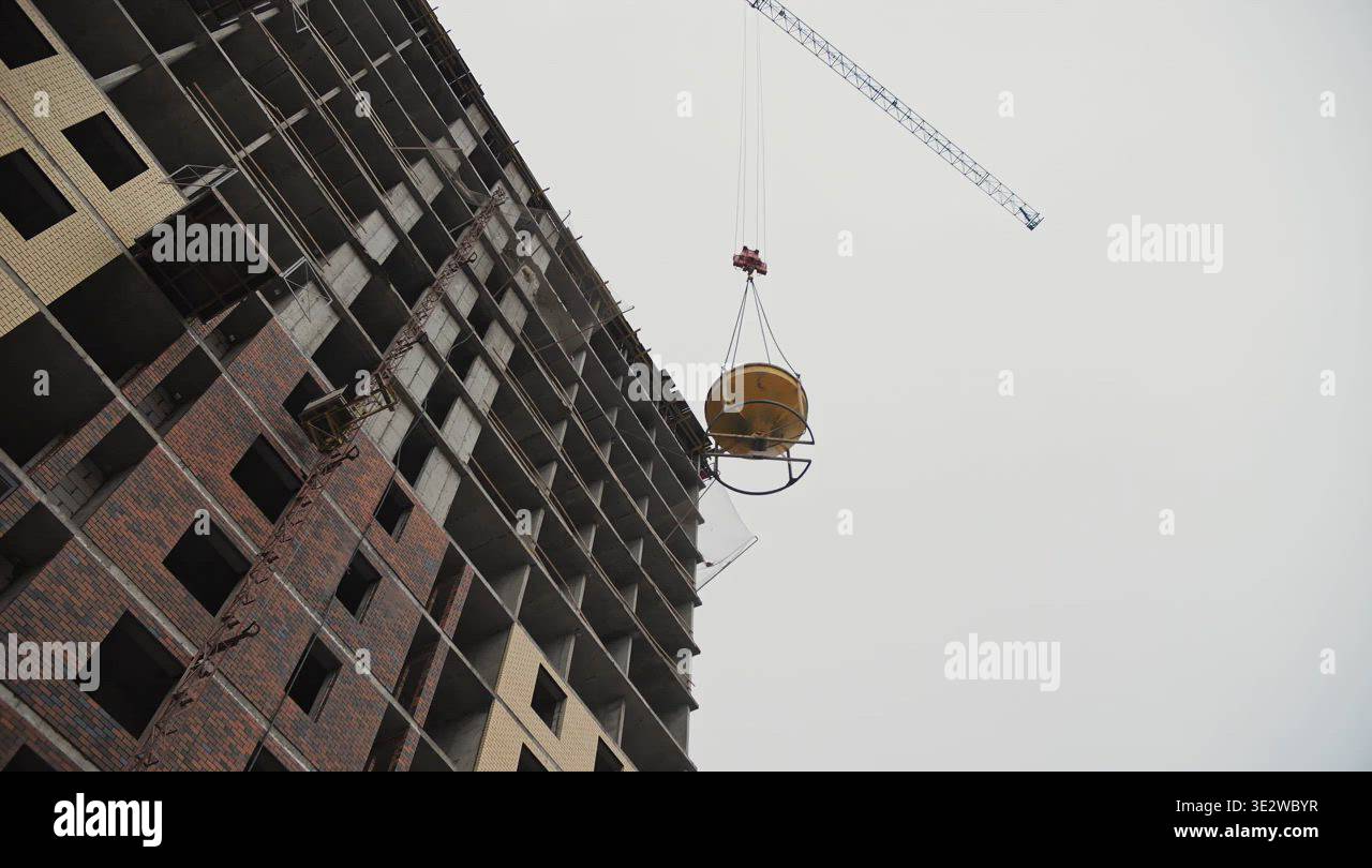 Construction Crane Lifting Concrete Bucket Stock Video Footage - Alamy