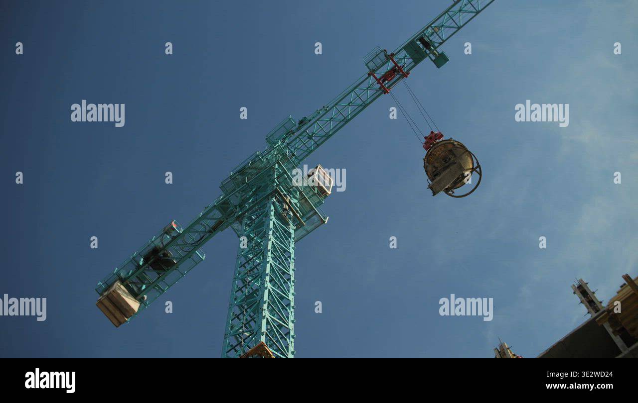 Tower Crane Lifting Concrete Bucket Stock Video Footage - Alamy