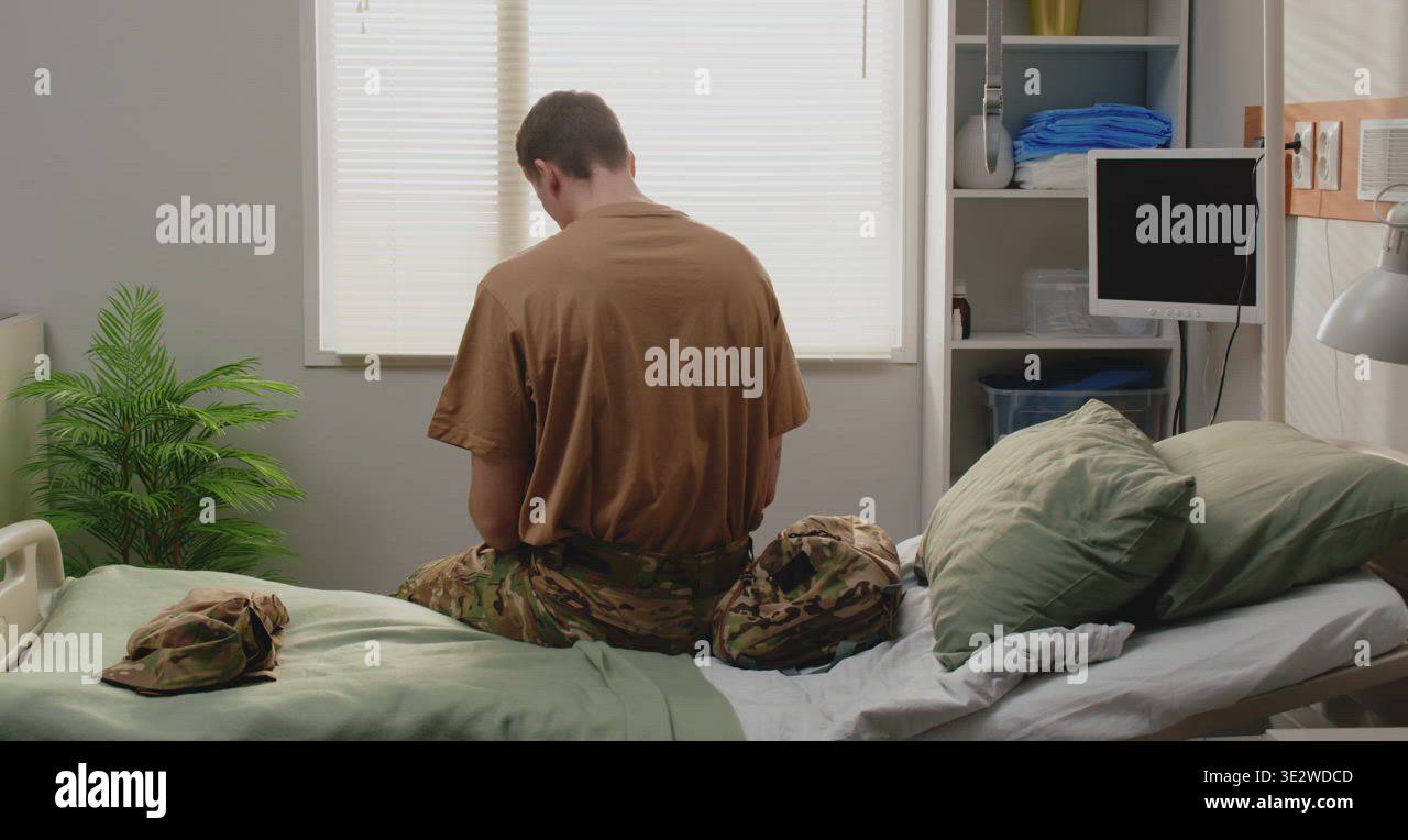 Soldier packing bag leaving hospital room Stock Video Footage - Alamy