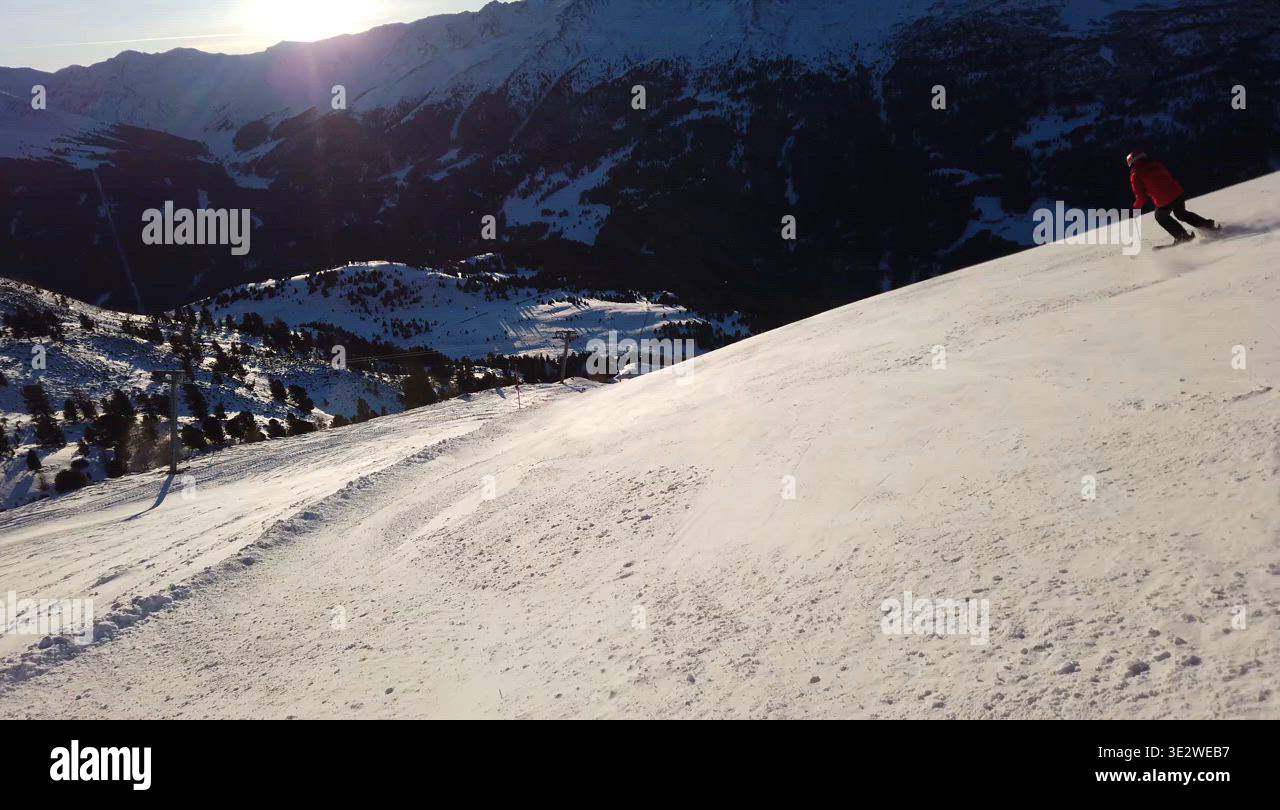 Red skier riding down slope Stock Video Footage - Alamy