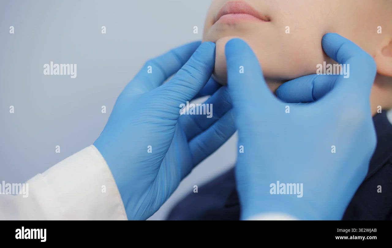 Examining Mole on Child's Face Stock Video Footage - Alamy