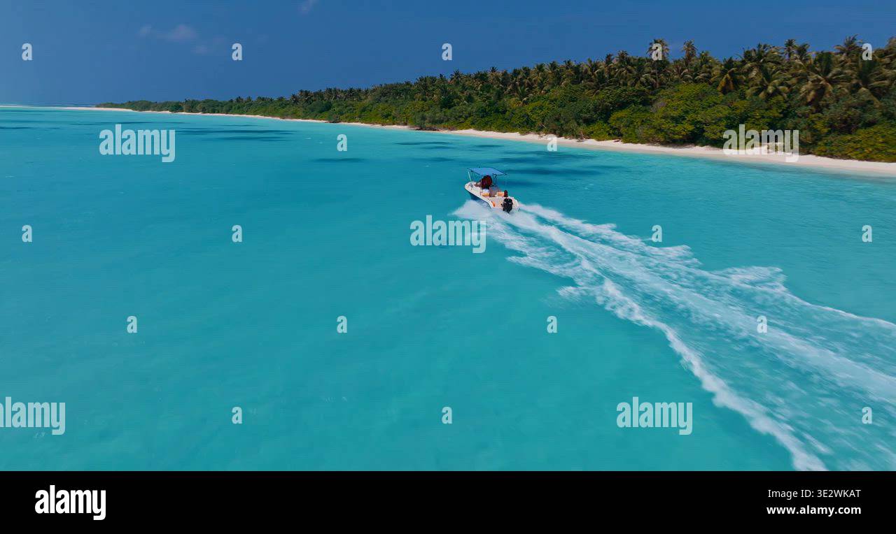 Boat moving along tropical island Stock Video Footage - Alamy