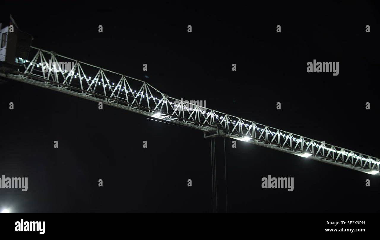 Illuminated Tower Crane Boom at Night Stock Video Footage - Alamy