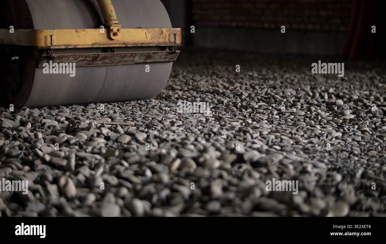 Road roller compacting gravel base Stock Video Footage - Alamy