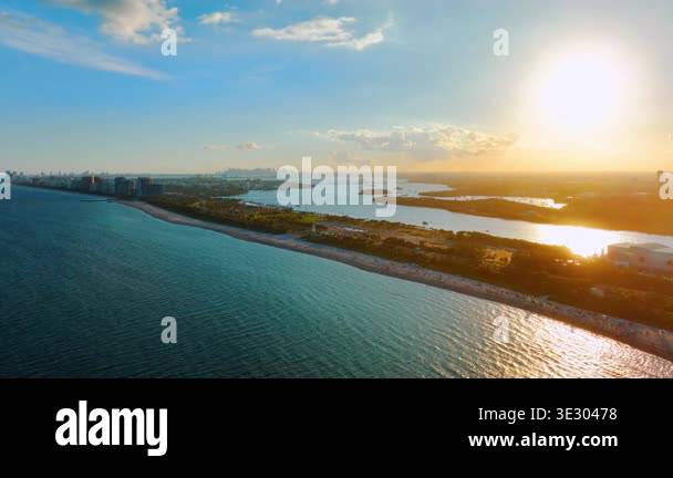 Panoramic shot of a narrow peninsula with beach, ocean, and inland ...