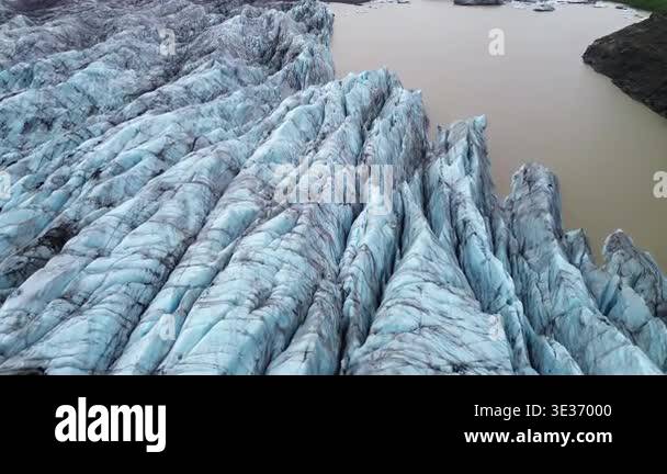Aerial drone view of deep crevasses of Falljokull glacier, an outlet of ...