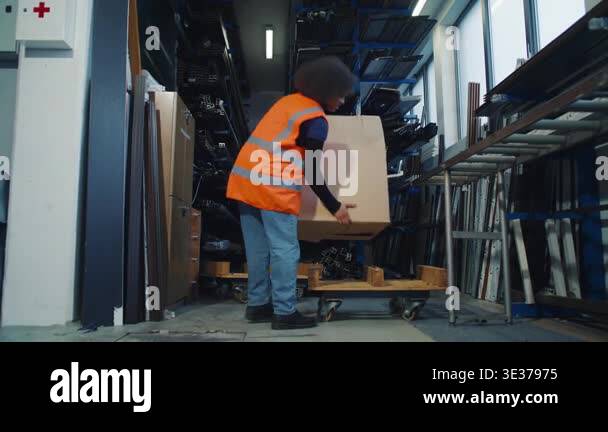 Woman, a logistics and warehouse worker suffering from back pain after ...