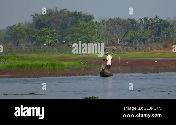 Dibrugarh, Assam, India 11 March 2026: A local fisherman stands on a ...
