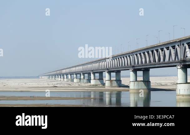 A long steel truss bridge supported by evenly spaced concrete pillars ...