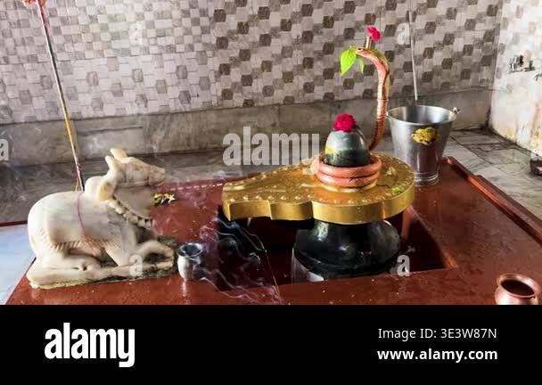 spiritual temple altar with incense smoke and sacred shivling offering ...