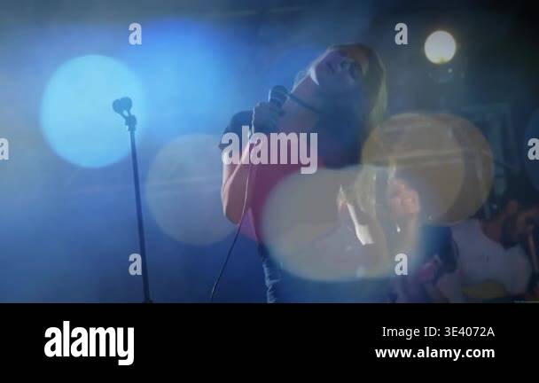 Female singer performing on live music stage, with animated equalizer ...