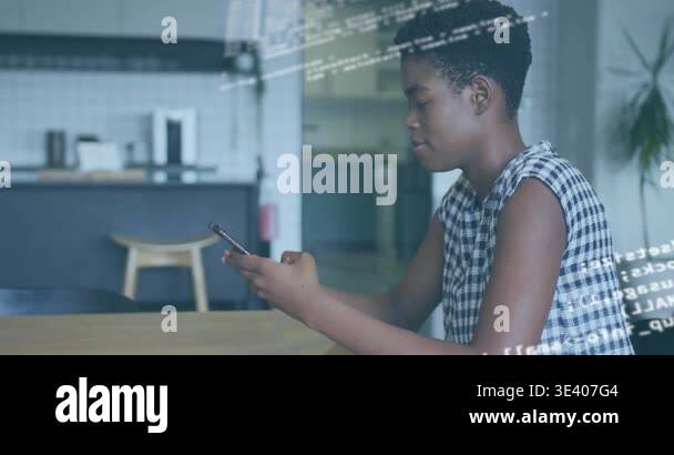 Young person using smartphone at home with coding animation overlay ...