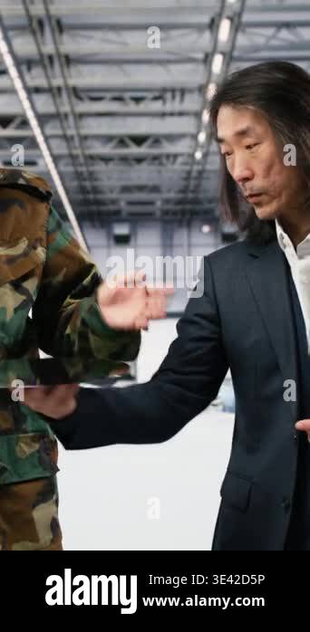 Vertical video Microelectronics production factory manager and soldier ...