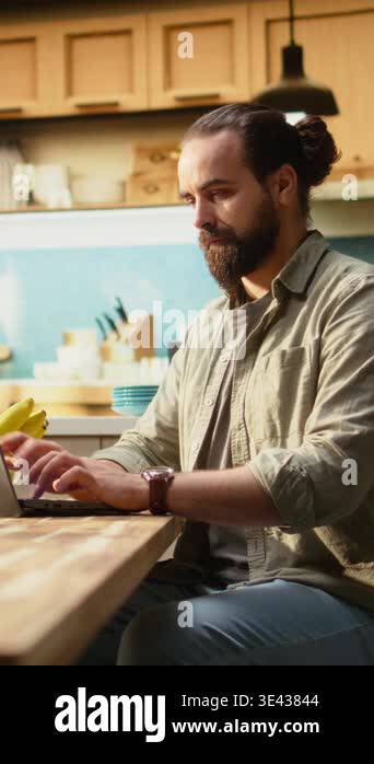 Vertical Video Unpunctual nervous man looking at time on wrist watch in ...