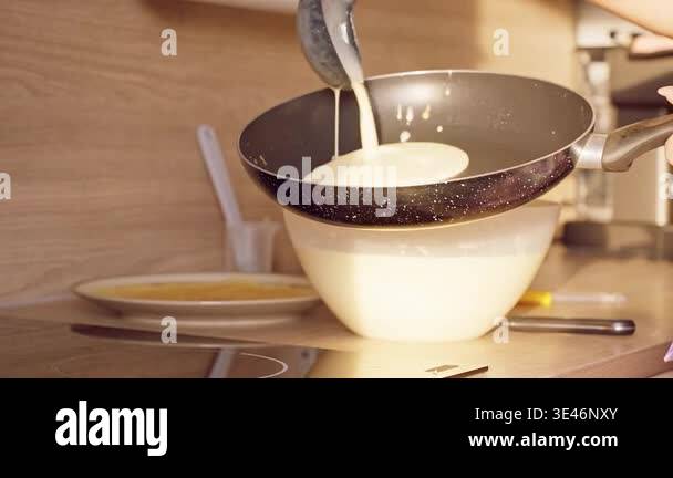 Close Up Of Ladle Pouring Smooth Batter Into Heated Frying Pan Above ...