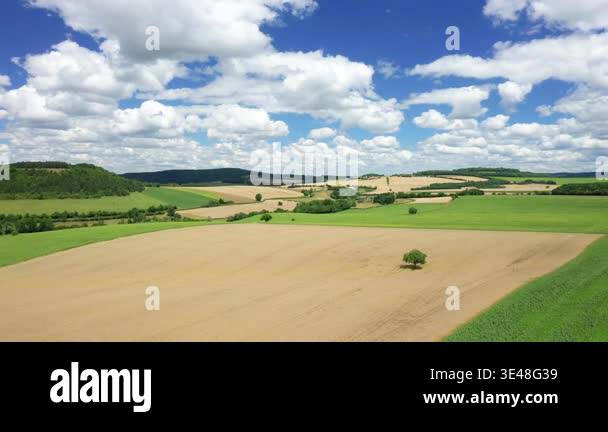 Aerial view of rolling fields and farmland in the French countryside on ...
