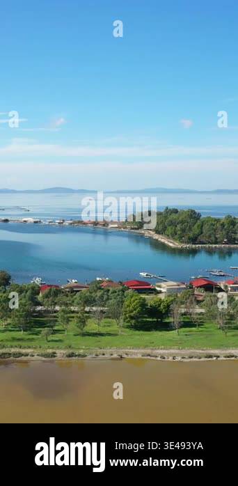 Aerial view of the picturesque village and lagoon landscape of Tourlida ...
