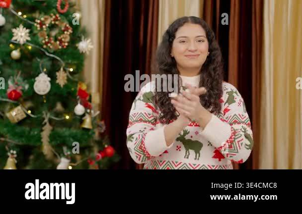 Indian Woman Clapping with Christmas Tree in background Stock Video ...