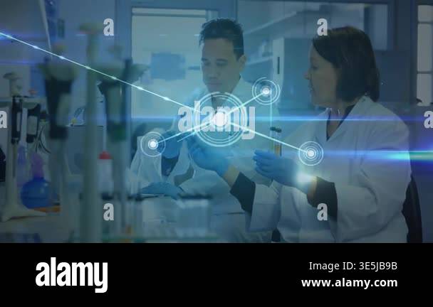 Scientists holding vial and examining sample while animated data ...