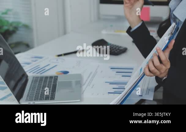 business man using calculator at work in the office, business concept ...