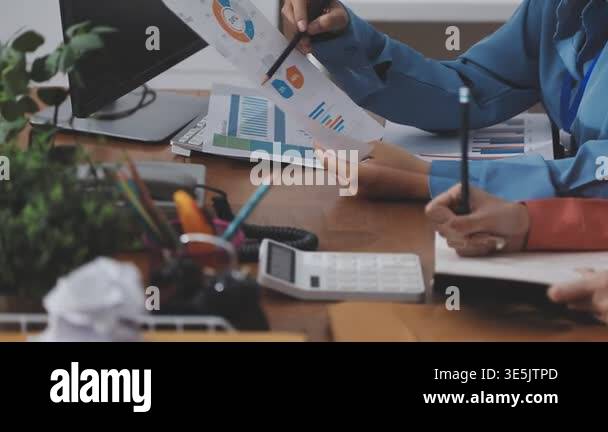 businessman using calculator and financial document on office desk ...