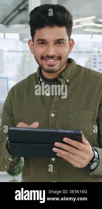 Likable successful man office manager in casual wear posing on camera ...