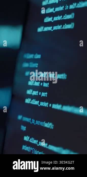 Close up of computer display with blue programming code on screen in ...