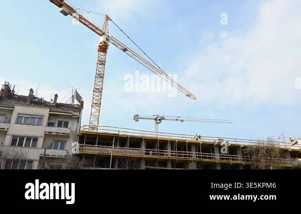 A multi-story residential structure under development featuring yellow ...