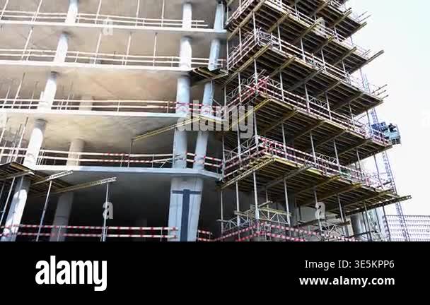 A large-scale construction site showing the skeletal frame of a ...