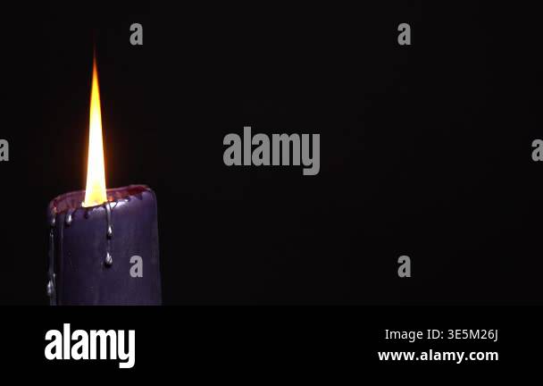 Black magic burning candle with dark background, selective focus ...