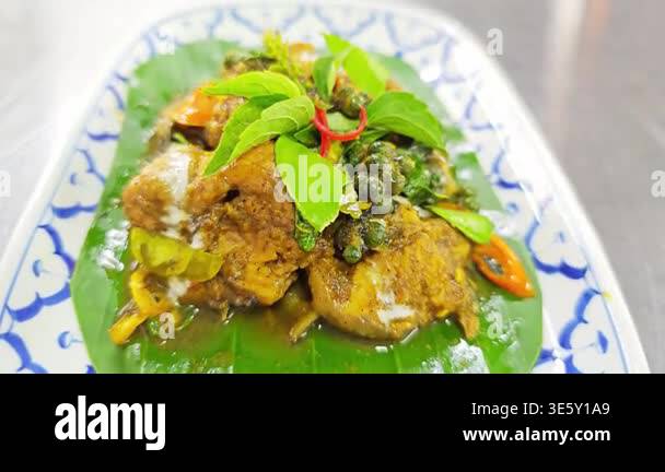 Authentic Thai Red Curry with Fish (Chu Chee Pla), garnished with ...